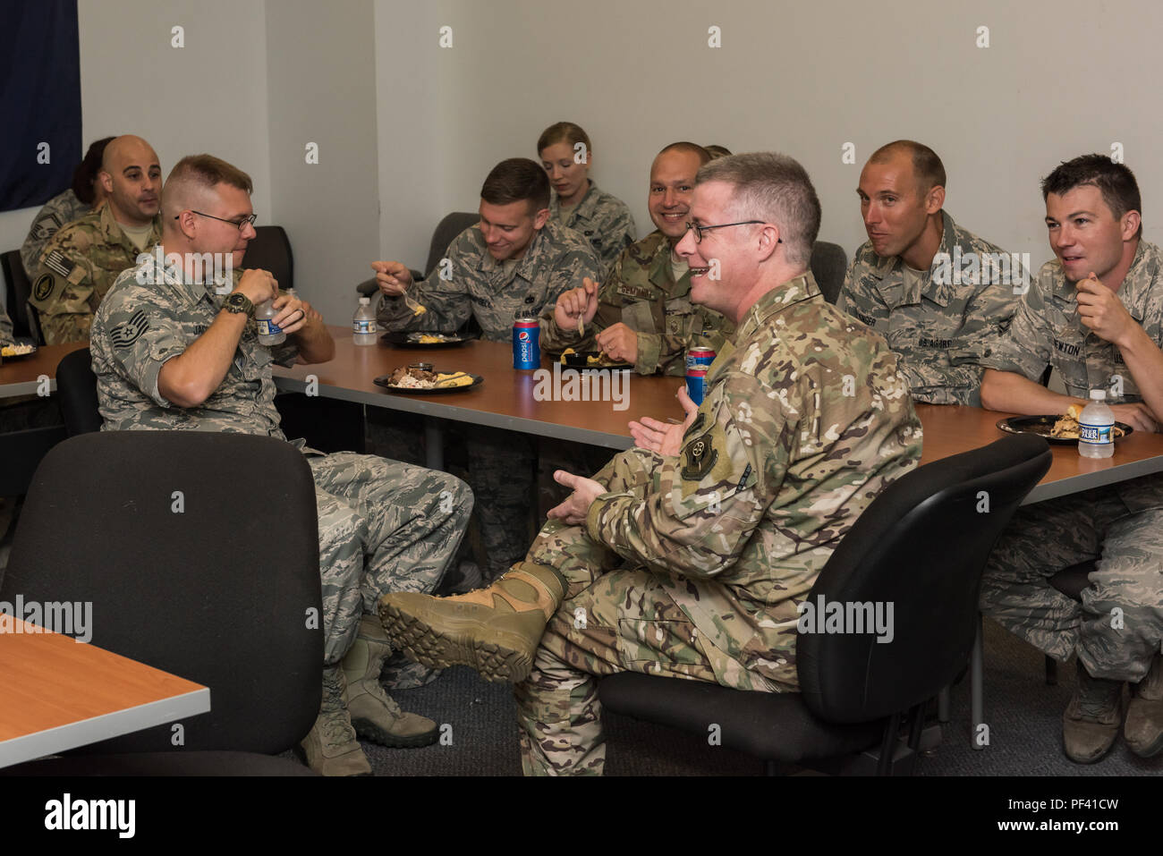 U.S. Air Force Chief Master Sgt. Gregory A. Smith (center), command chief master sergeant of Air ...