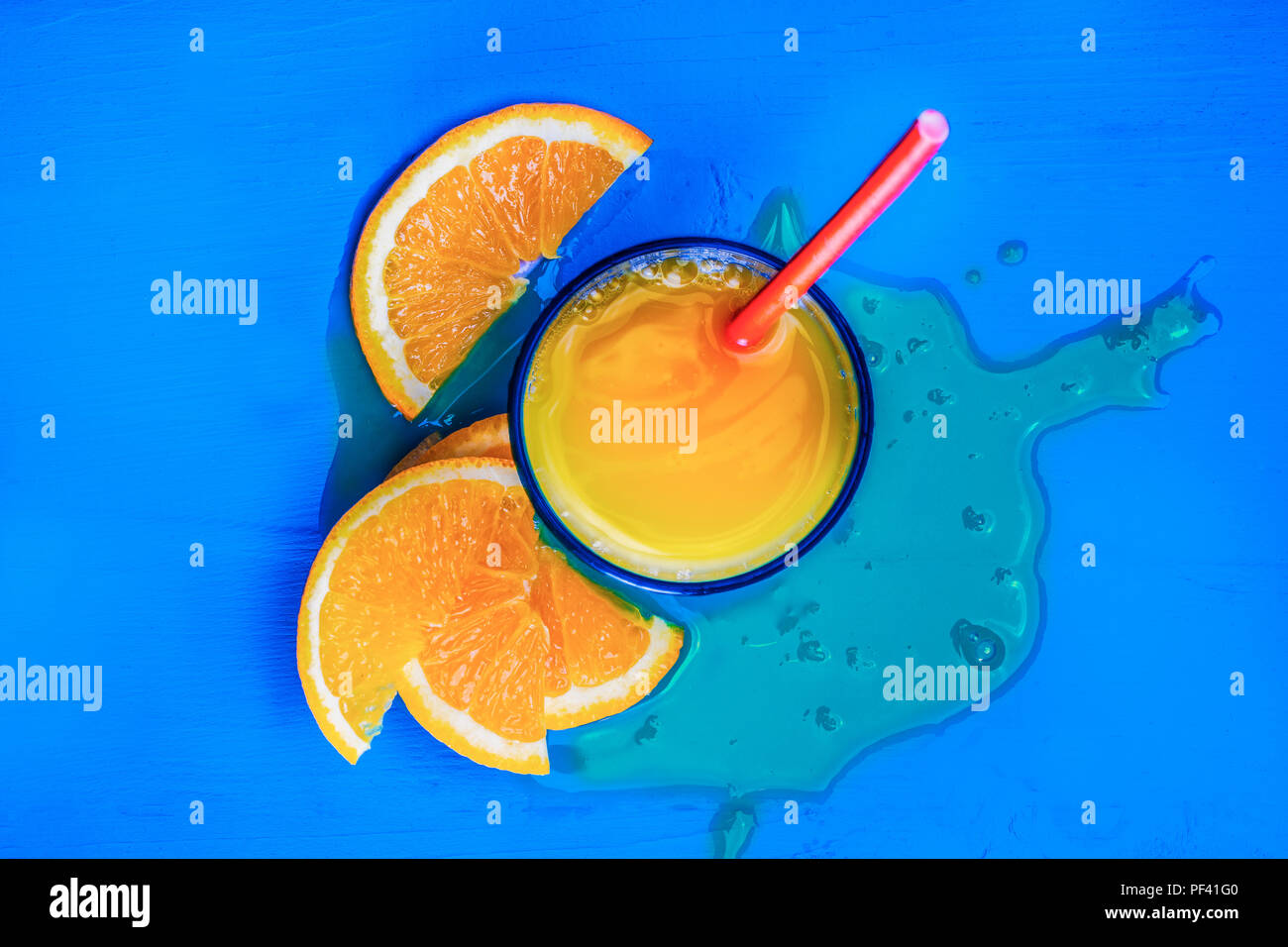 Glass of orange juice from above on vintage blue table Stock Photo - Alamy