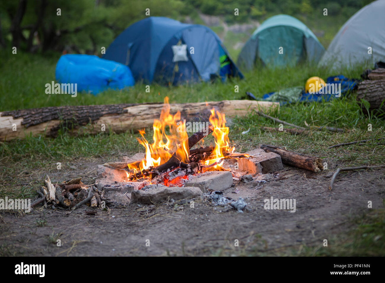 Photo of campground and campfire in forest Stock Photo - Alamy