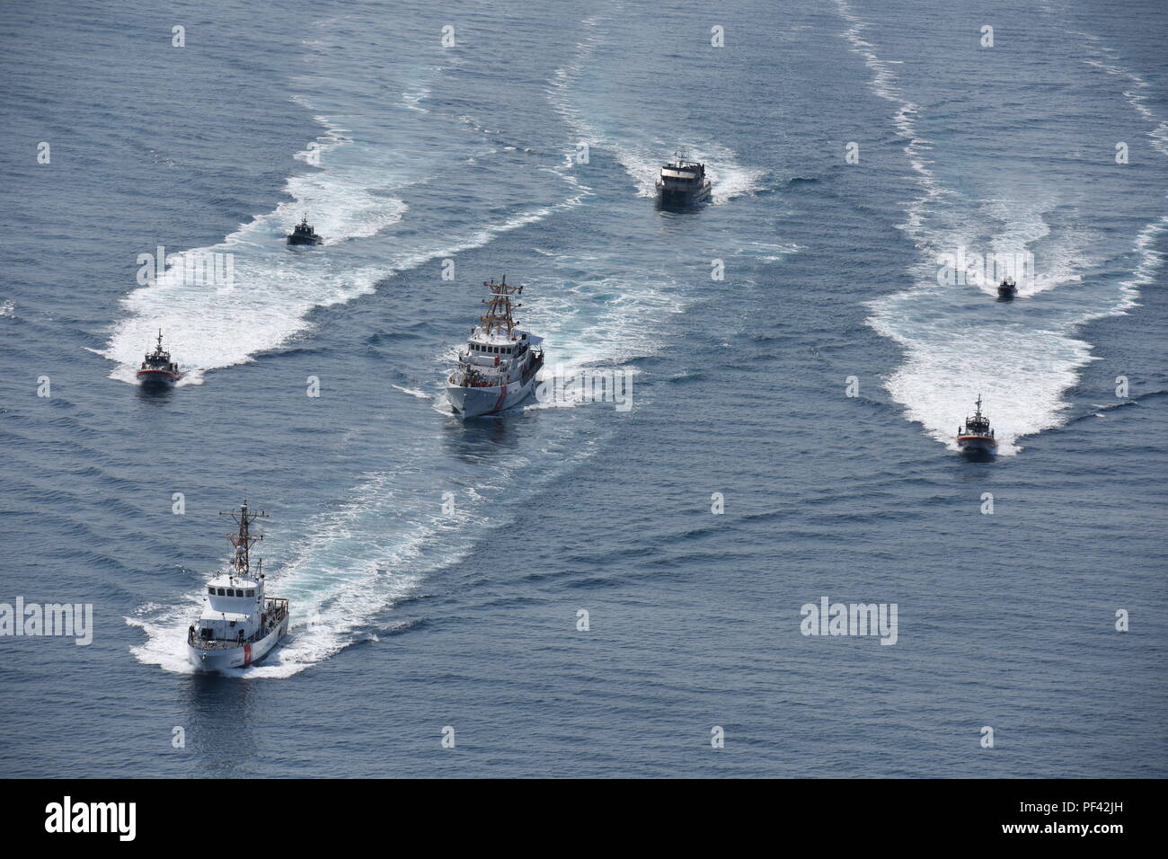 The Coast Guard Cutter Forrest Rednour, is escorted by the Coast Guard ...
