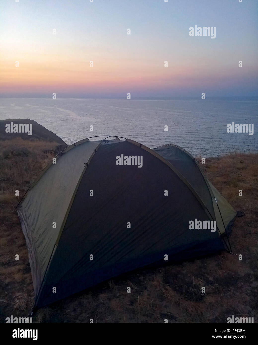Sunset over the sea, sunset over the tent. Tent by the sea Stock Photo ...