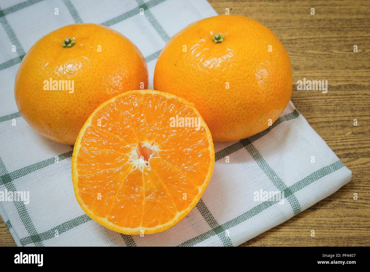 Fresh Ripe Whole and Cross Section Oranges on A Wooden Table, Orange Is ...