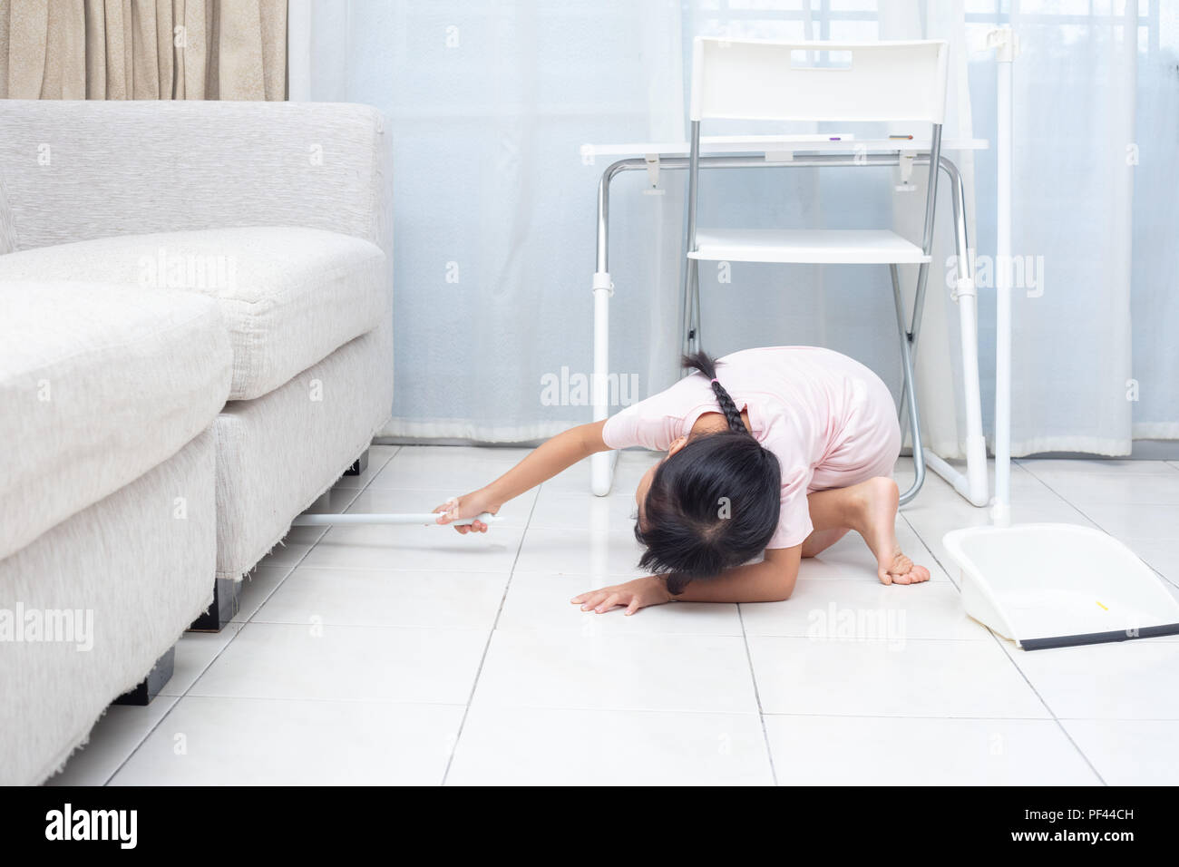 Asian Chinese little girl helping doing cleaning with broom and dustpan ...