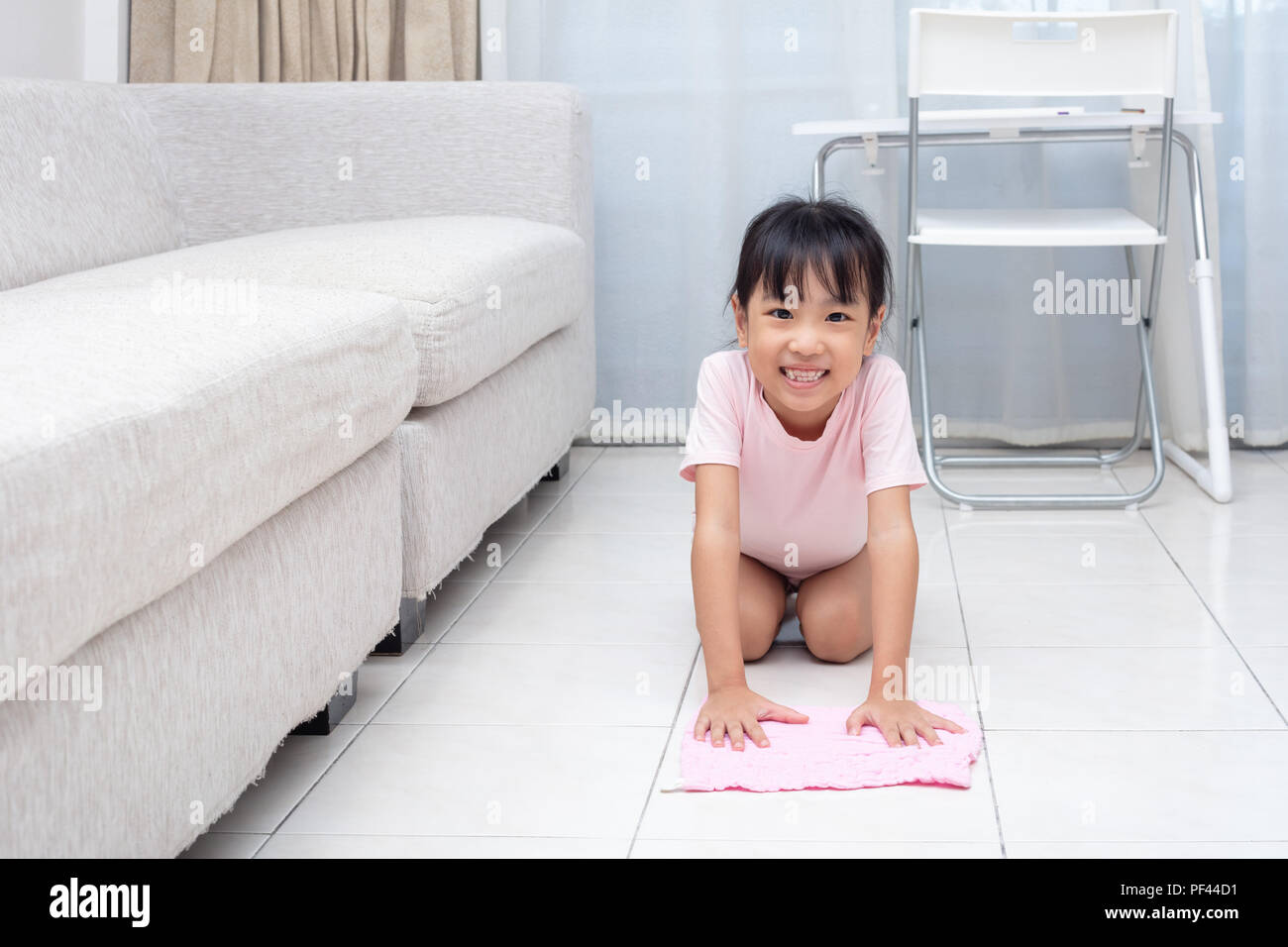 Asian Chinese little girl helping doing cleaning with rag at home Stock ...