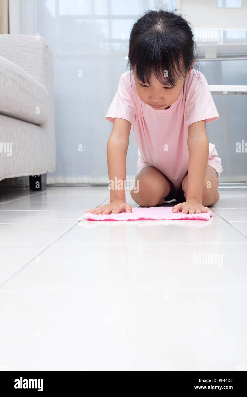Asian Chinese little girl helping doing cleaning with rag at home Stock ...