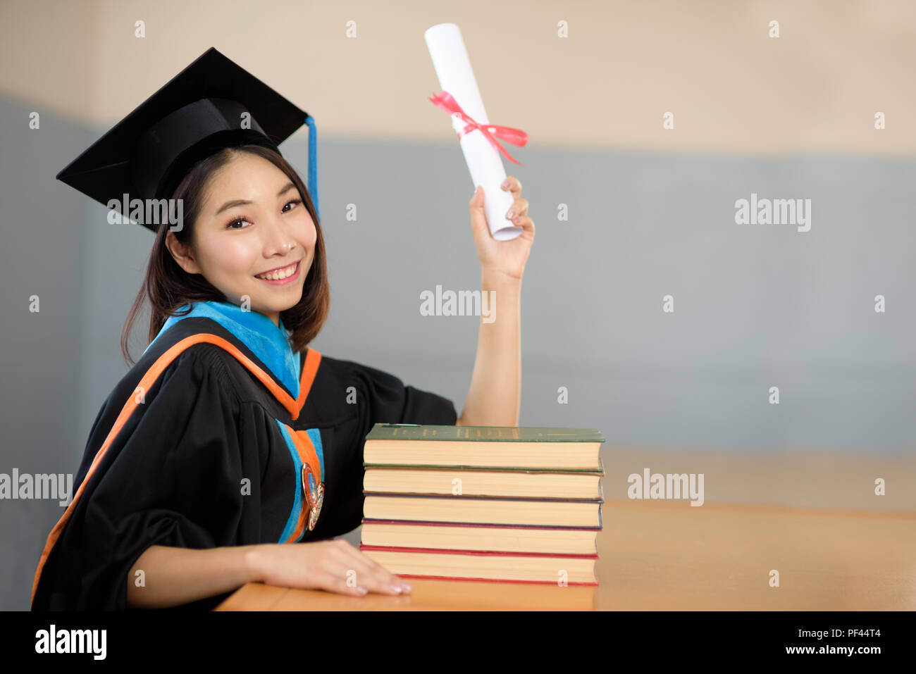 Graduates celebrate the graduation day at the university library Stock ...