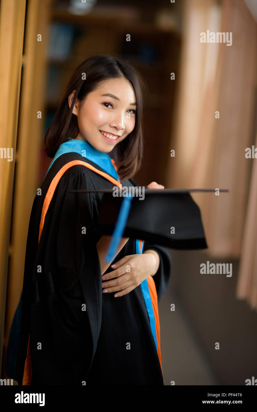 Graduates celebrate the graduation day at the university library Stock ...