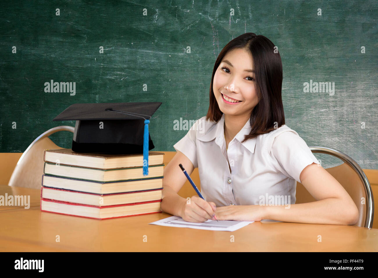 Young students take notes in the university library,Graduation Concept ...