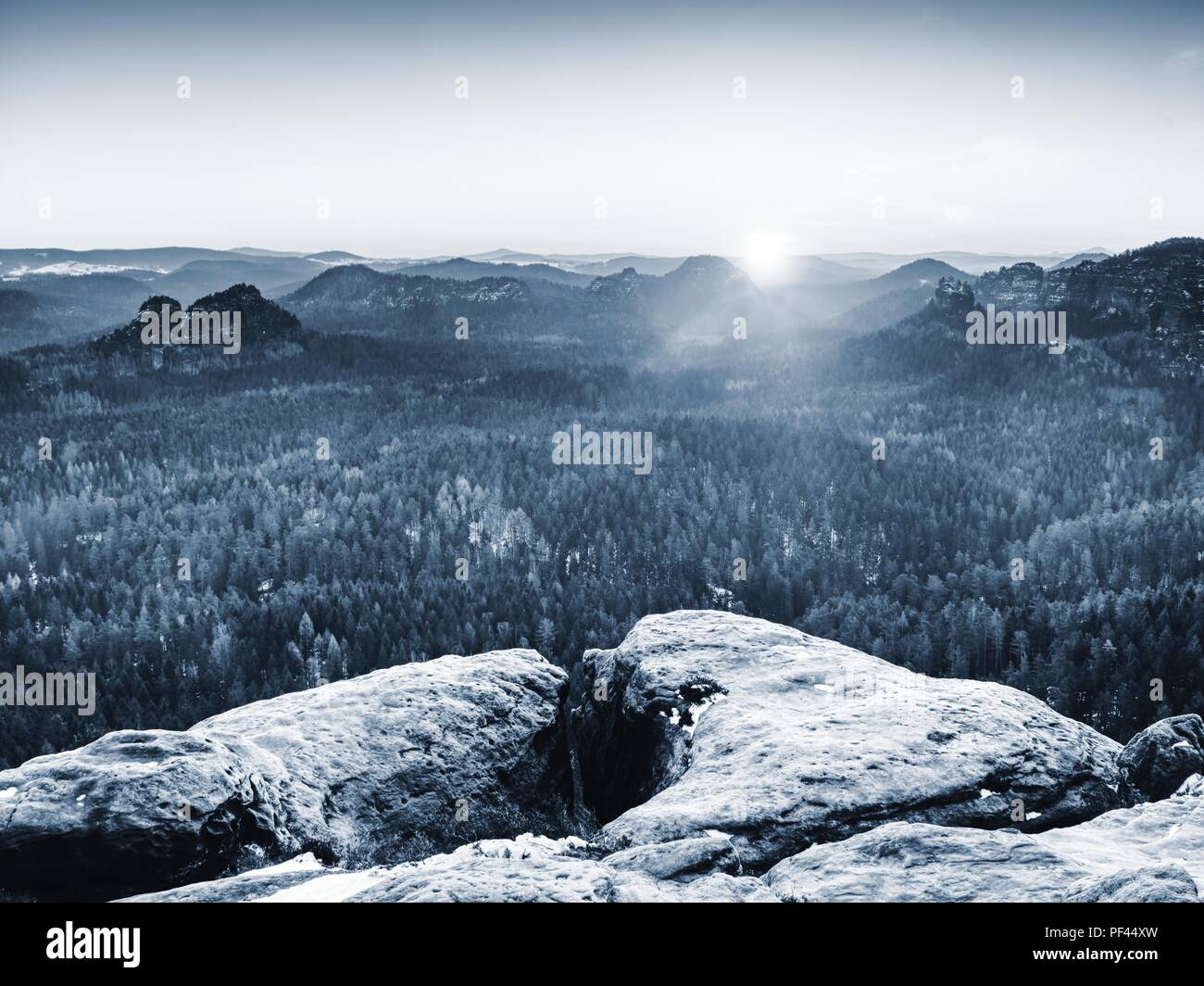 View from rock to far horizon with light rays and lens flare effect ...