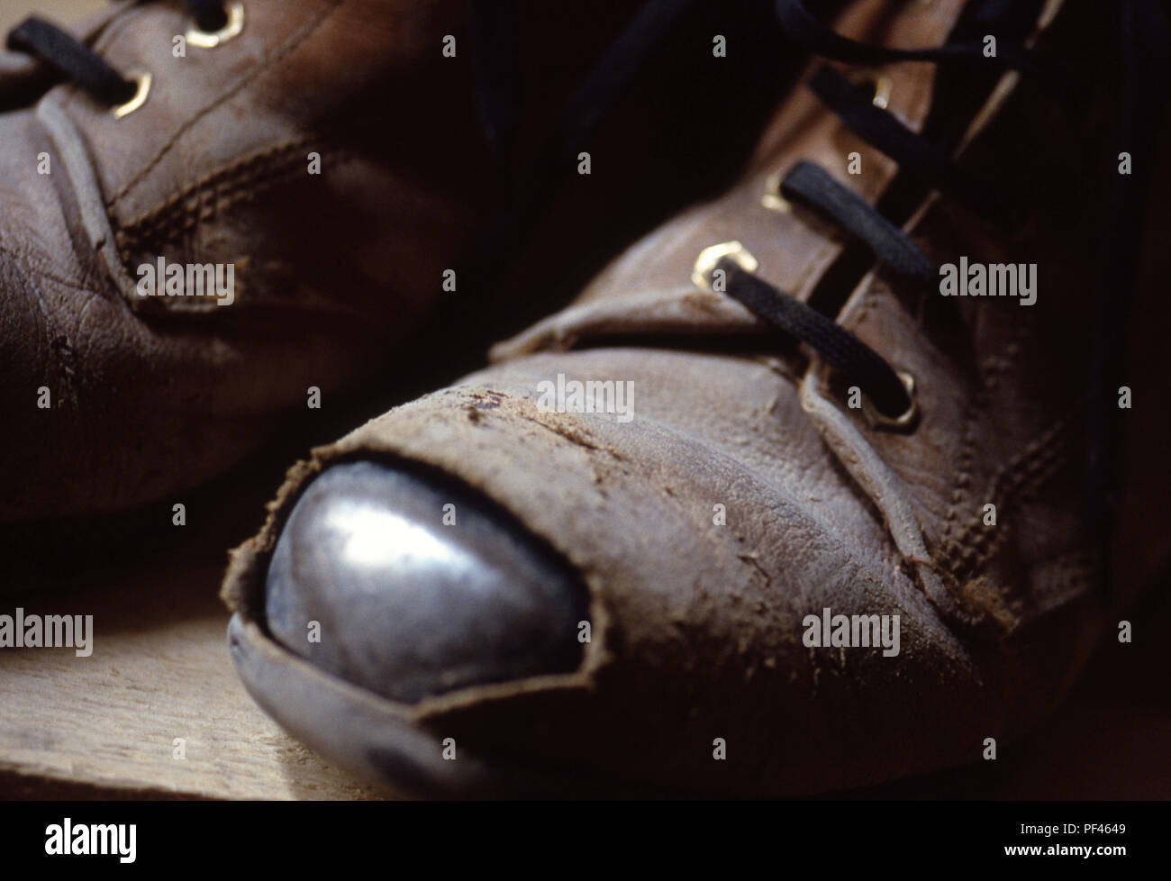 Well worn steel cap boots from a builder at a construction site Stock ...
