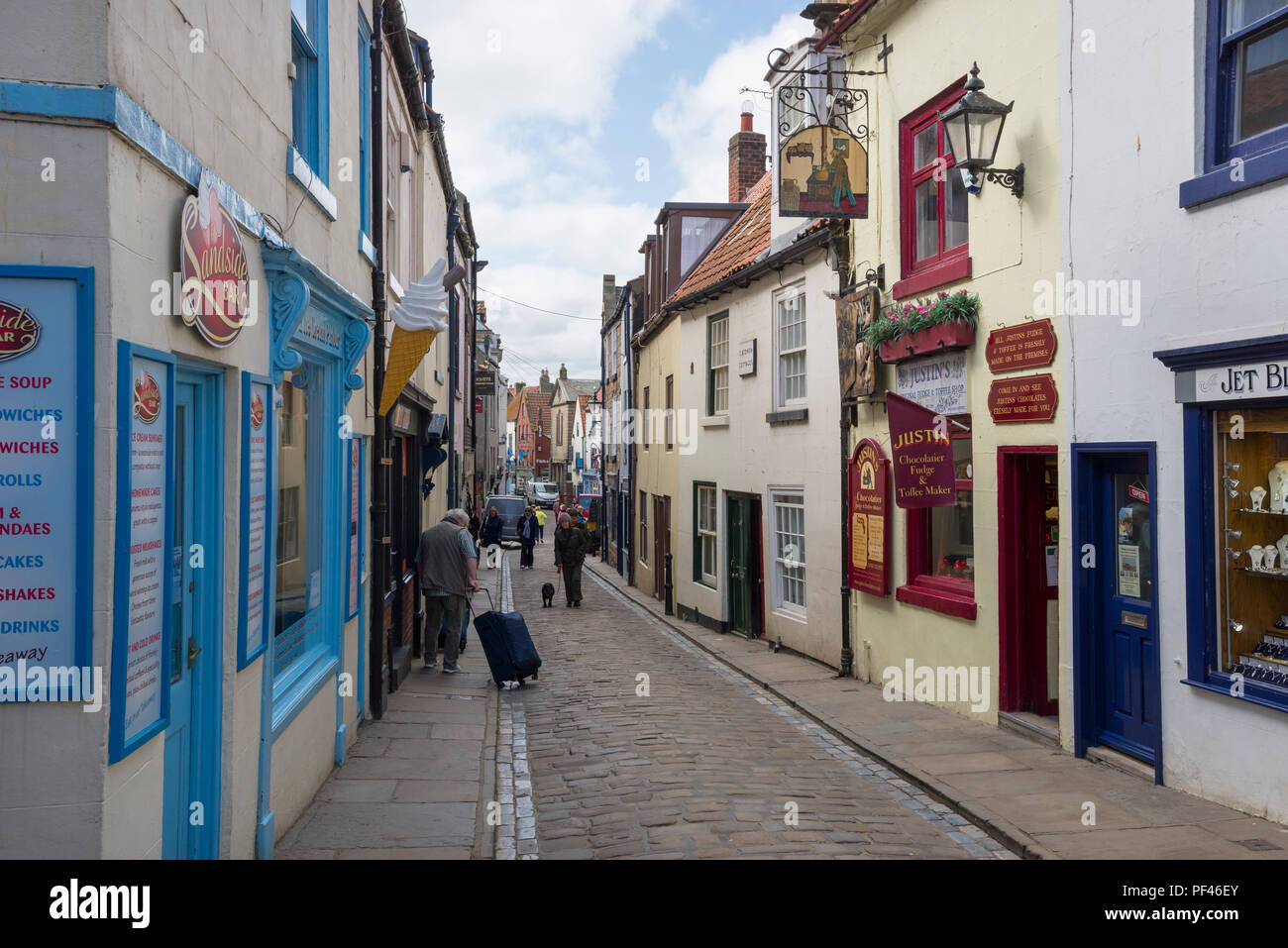 Busy old street in the historic seaside town of Whitby on the coast of ...