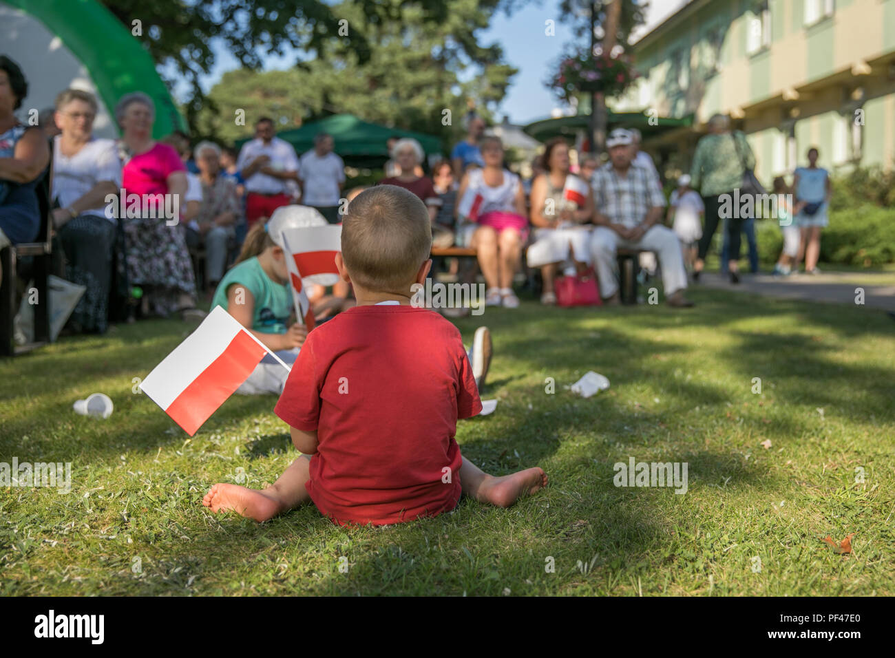 Children with white and red polish flag in the hand. Celebration of ...