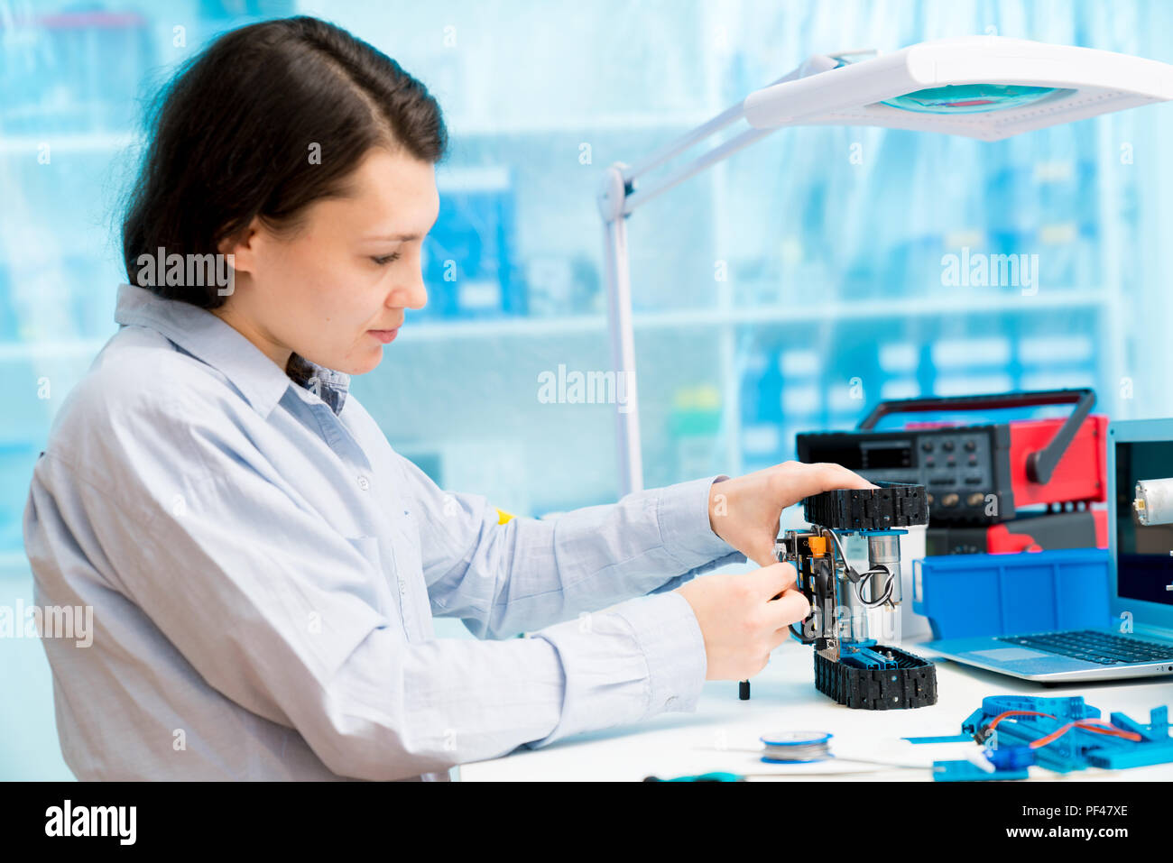 Young woman in CNC and robotics laboratory Stock Photo - Alamy