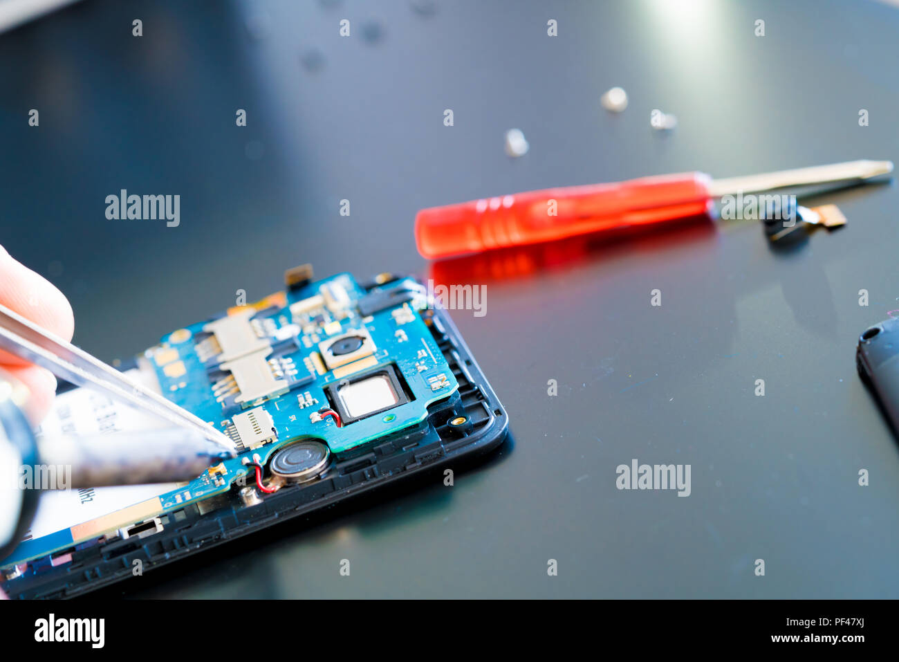 Fix and repair cell phone PCB Stock Photo - Alamy