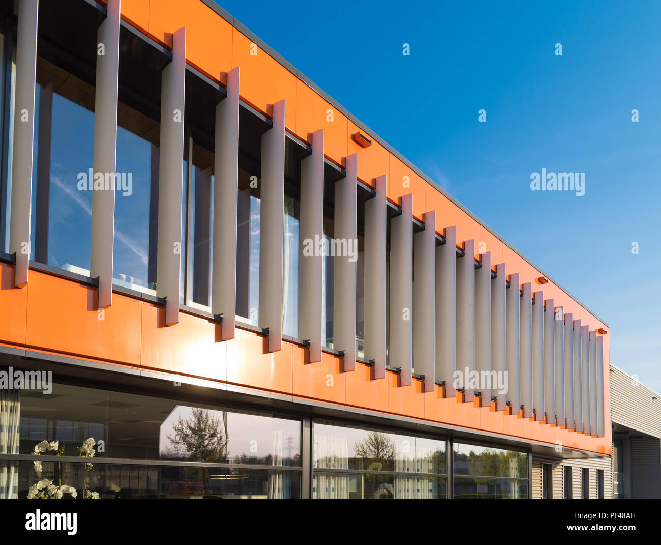 facade of a modern orange office building in the netherlands Stock ...