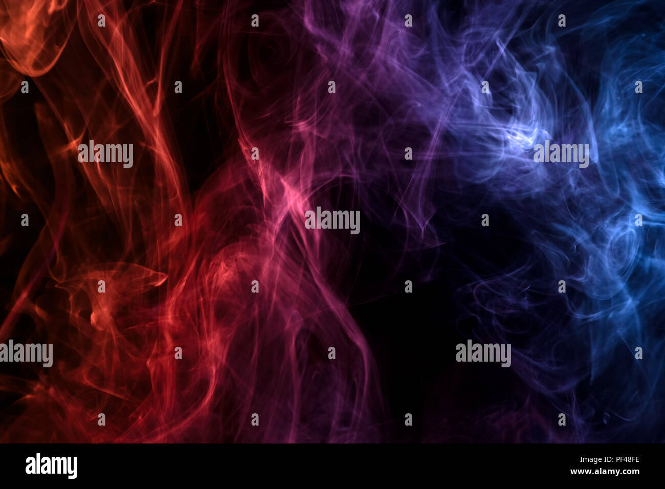 Cloud of red,blue and purple smoke on a black isolated background ...