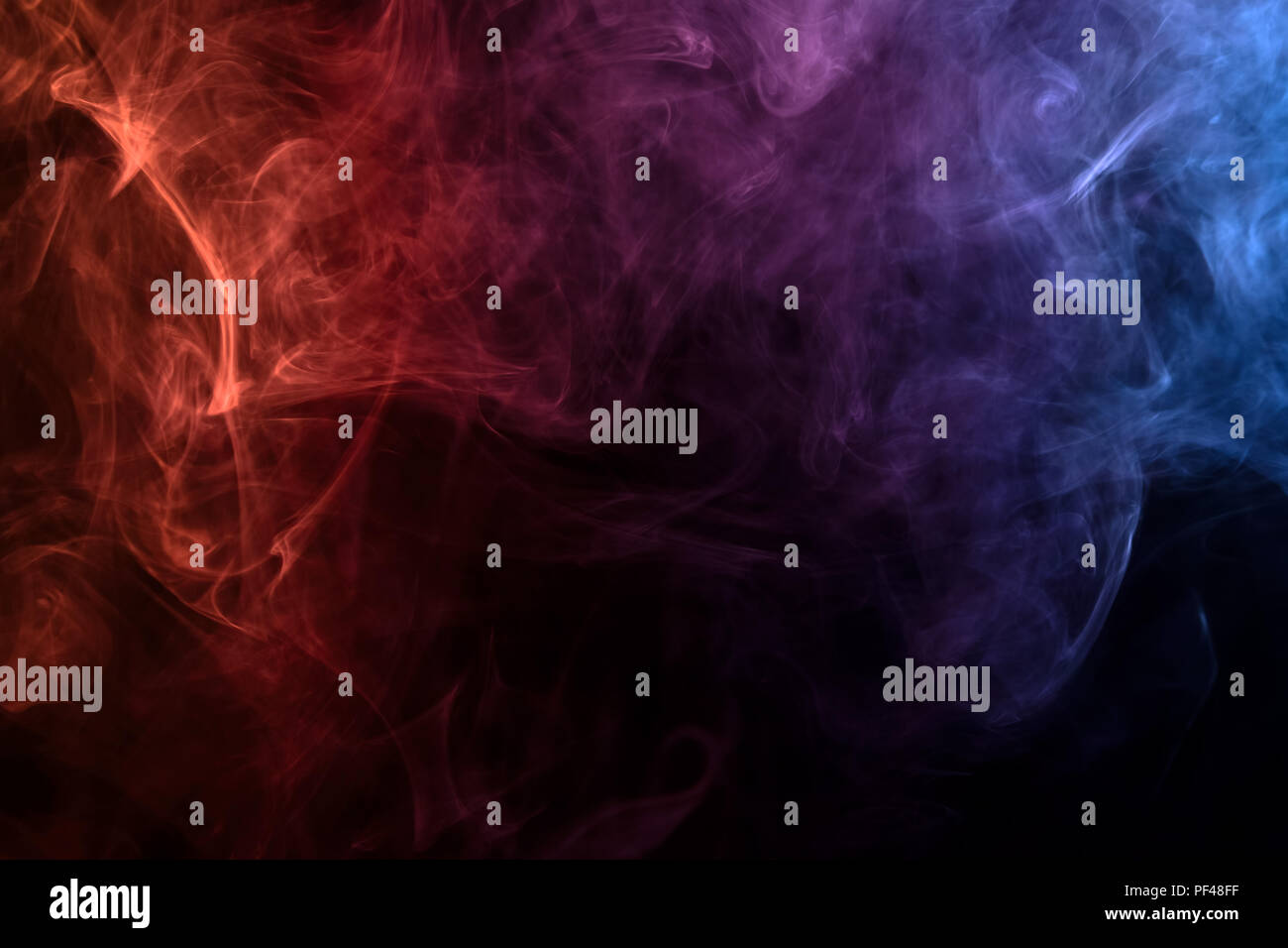 Cloud of red,blue and purple smoke on a black isolated background ...