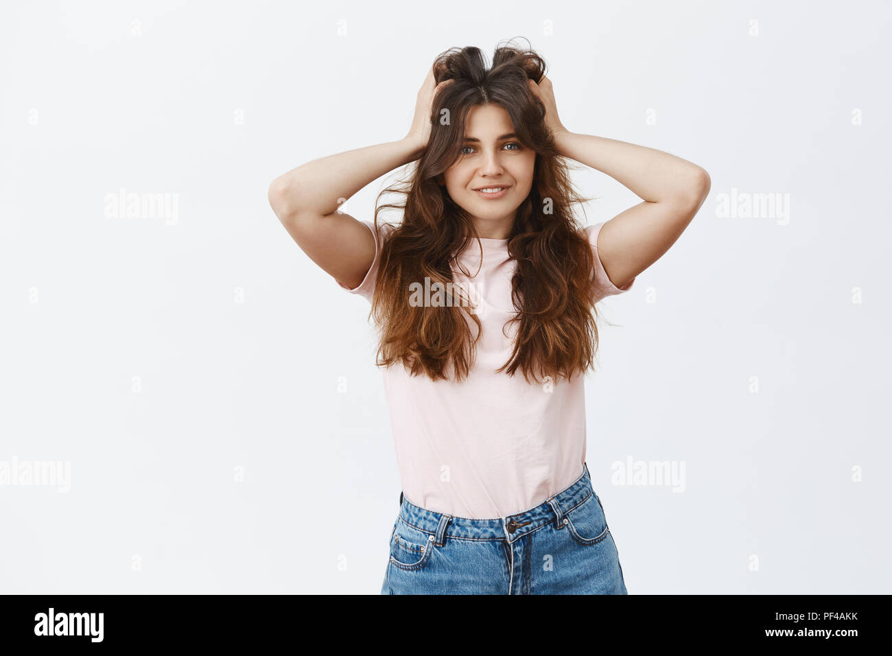 Indoor shot of happy and carefree woman feeling satisfied after vising ...