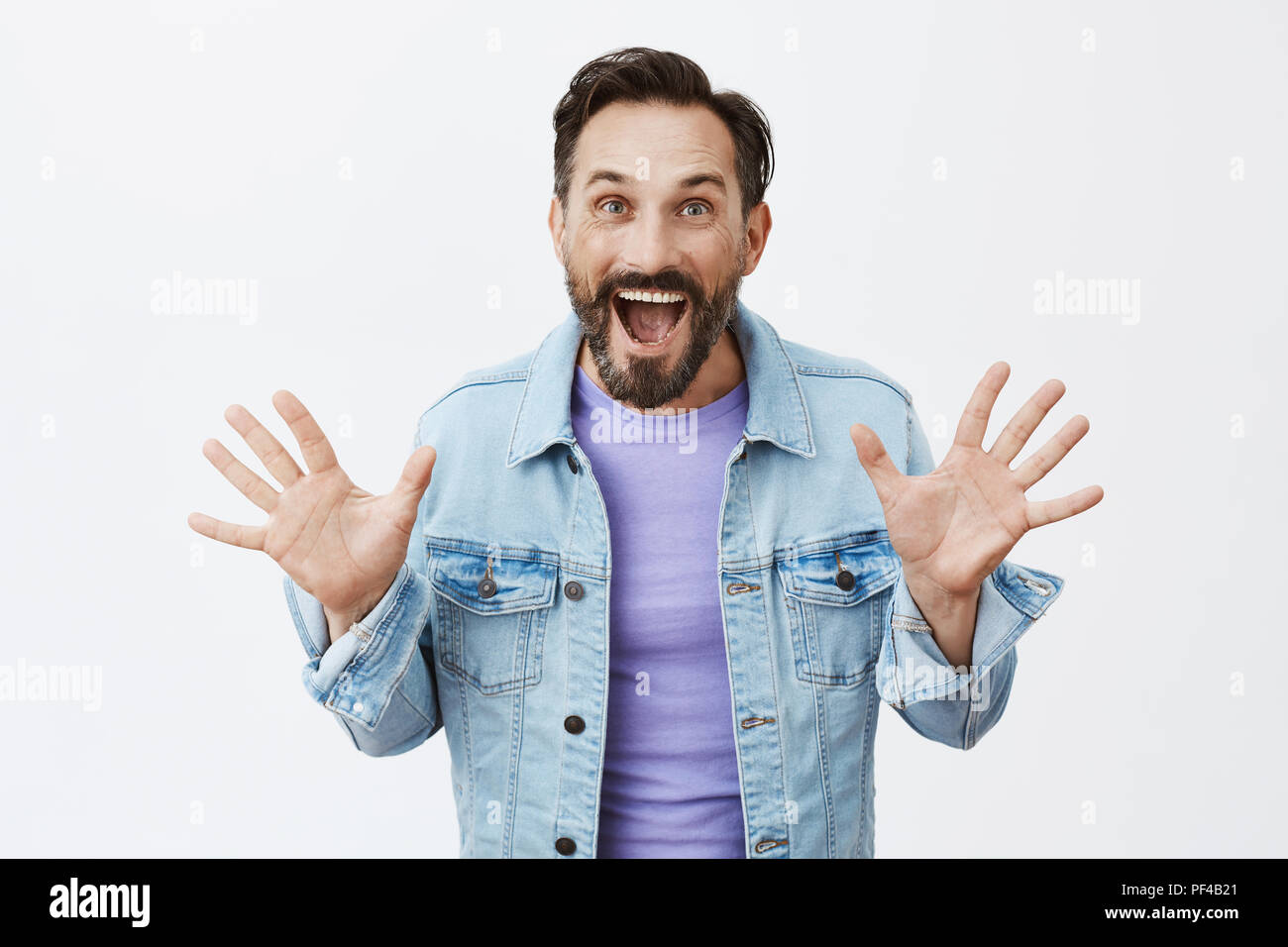 Boo. Charming carefree and happy adult guy with beard and moustache in ...