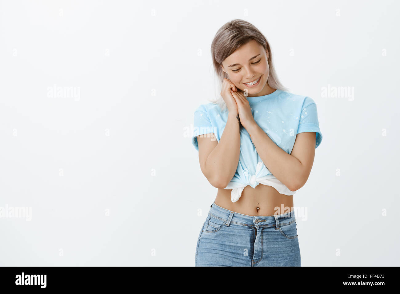 Love him so much. Portrait of tender and timid charming woman standing ...