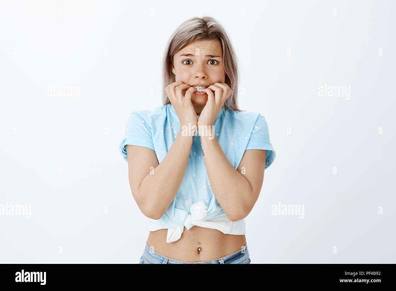 Help, I am shaking from fear. Scared timid cute girl with fair hair in ...