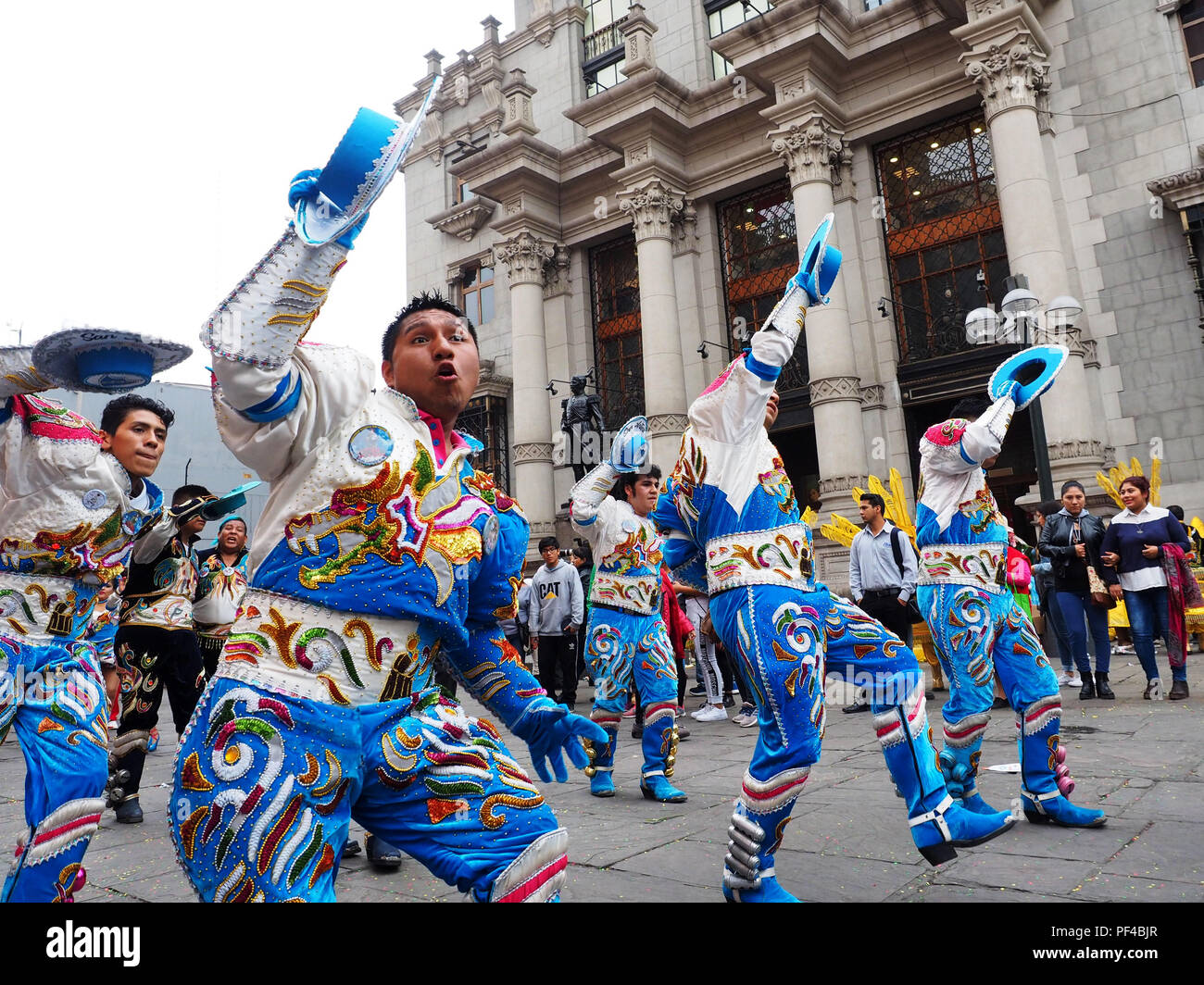 A troup in traditional dress dancing morenada during the grand parade ...