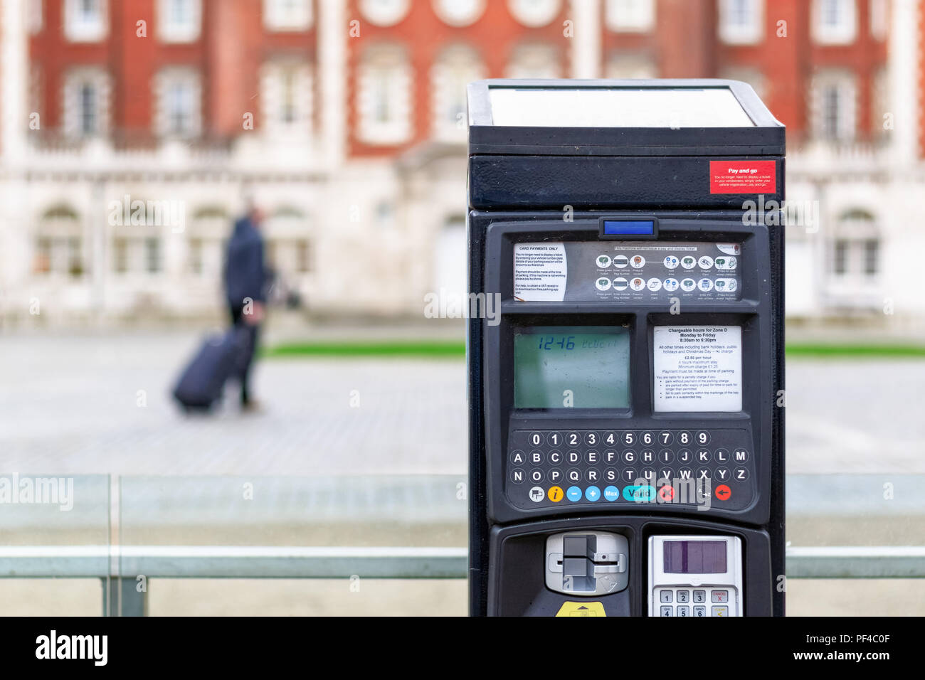 Car park ticket machine on a London street with an unidentified ...