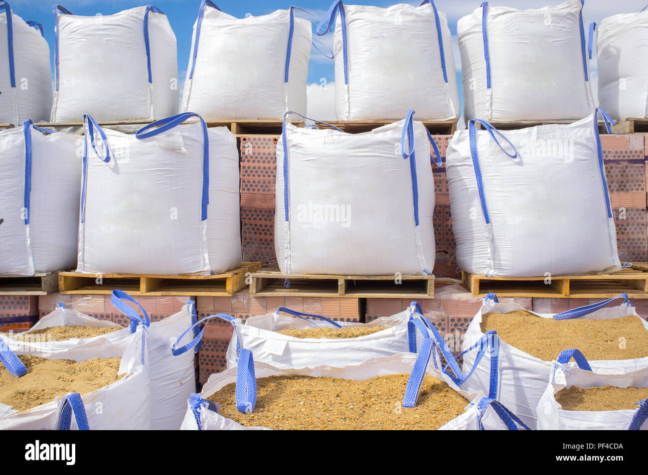 Stacks of raffia large sand sacks stacked over wooden pallets with ...