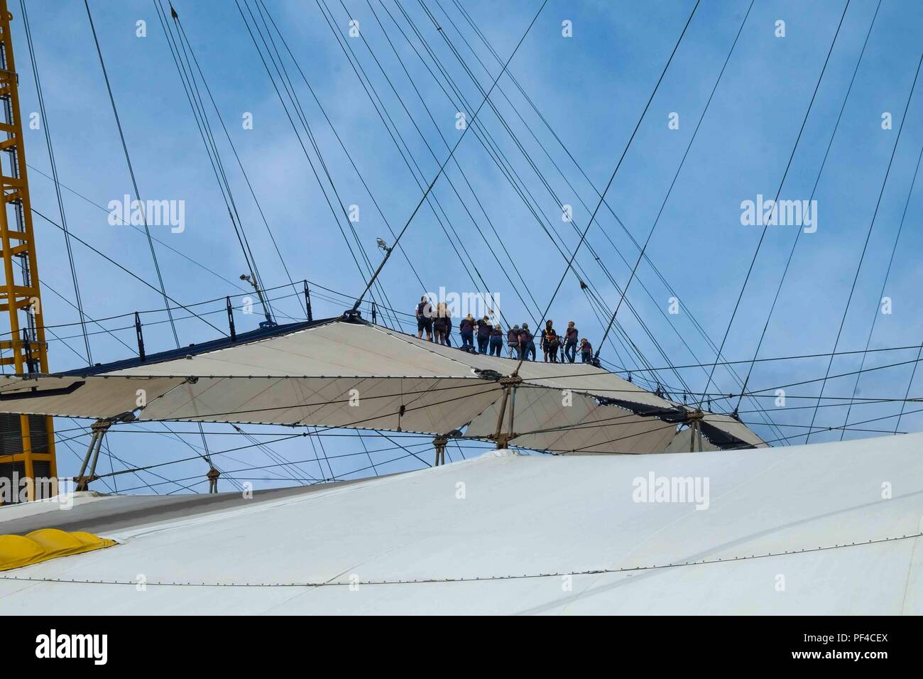 Up At The O2. People walking on top of the roof of the O2 Arena in ...
