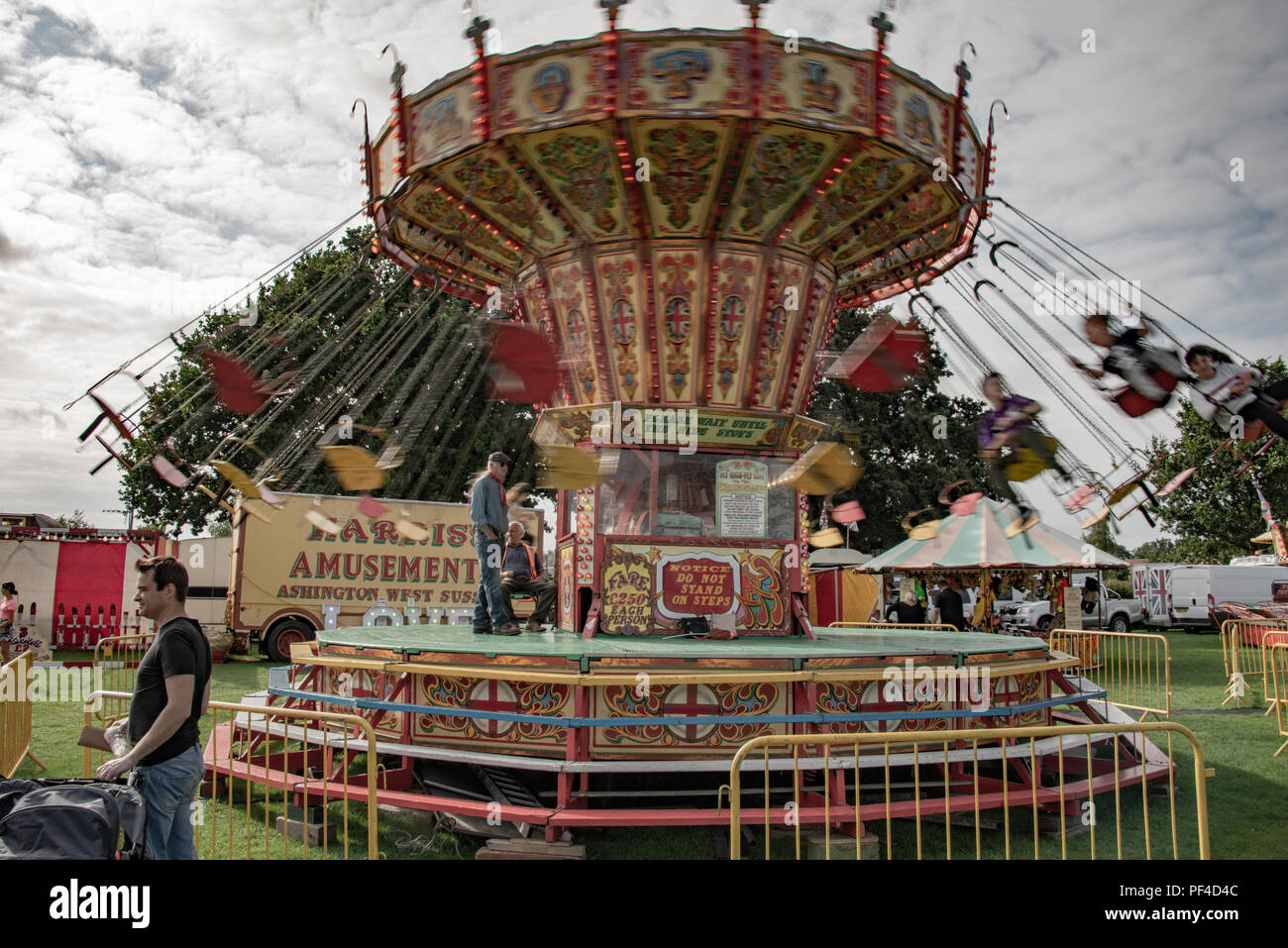Harris's Fair ground with hanging chairs on roundabout Stock Photo - Alamy