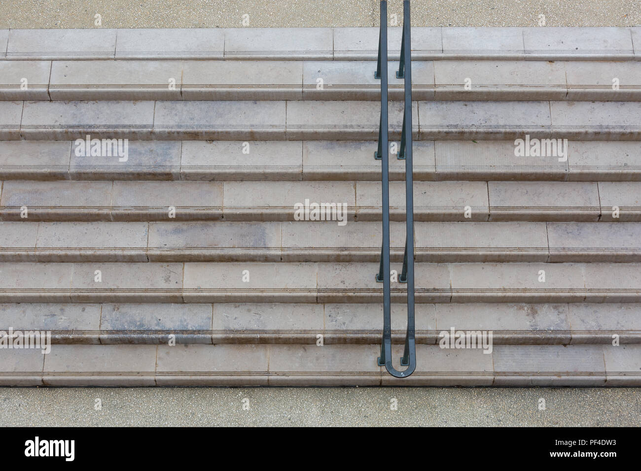 Symmetric stone stairs with handrail from above Stock Photo - Alamy