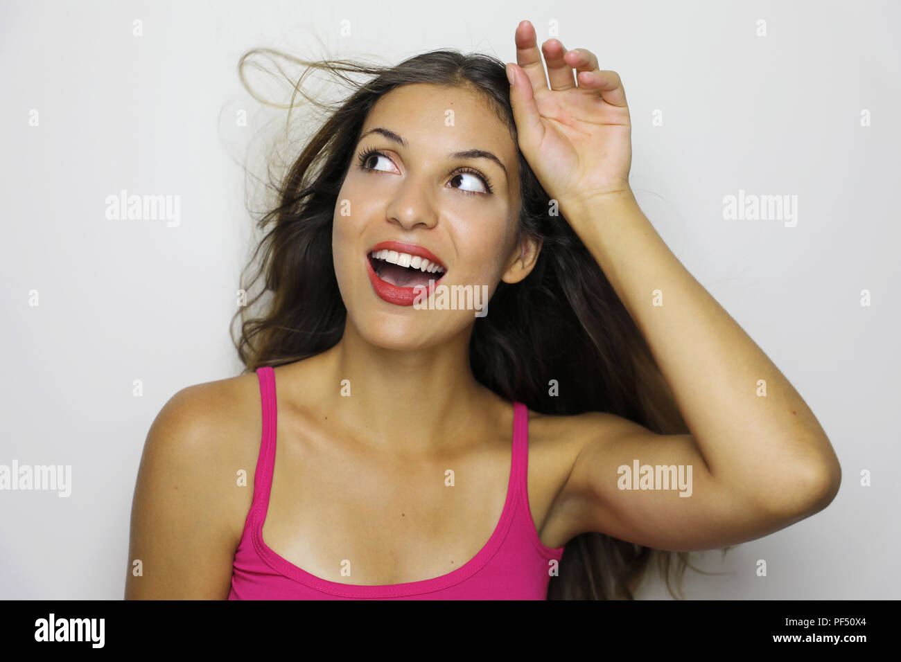 Attractive woman looking sideways and enjoying wind in her face in ...