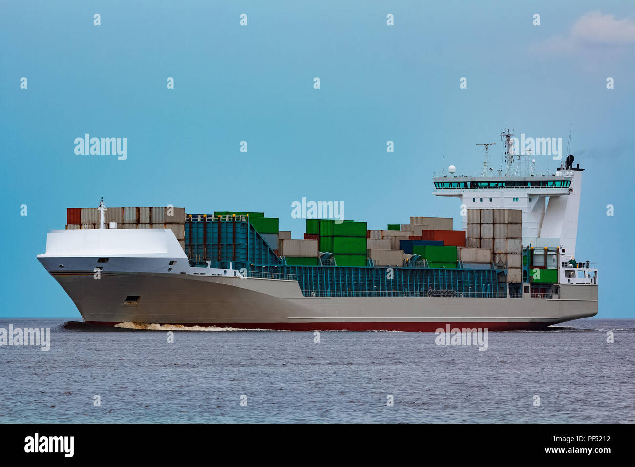 Grey container ship. Logistics and production import Stock Photo - Alamy