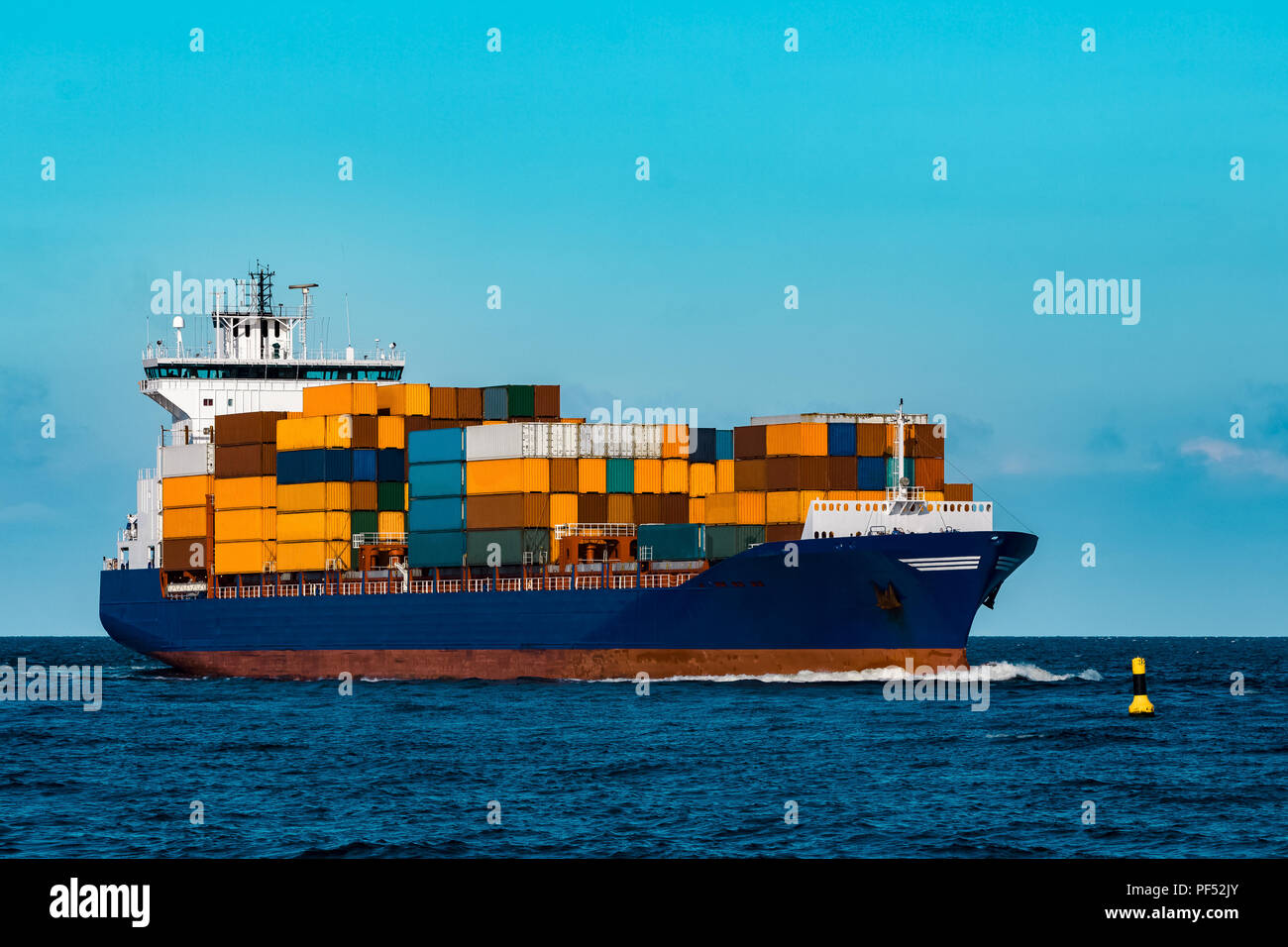 Blue container ship in travel. Logistics and freight industry Stock ...