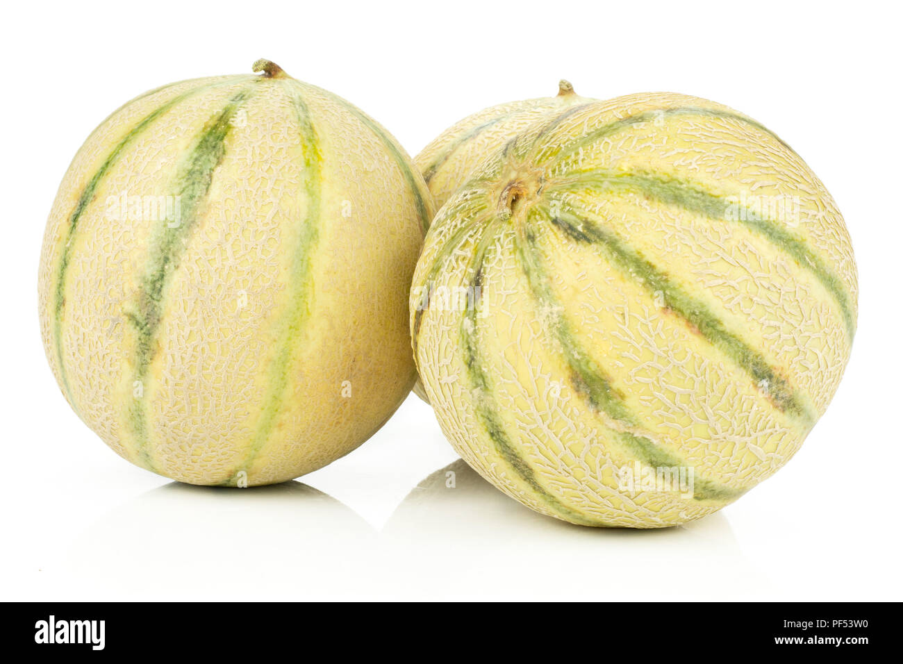 Group of three whole fresh melon cantaloupe variety isolated on white ...