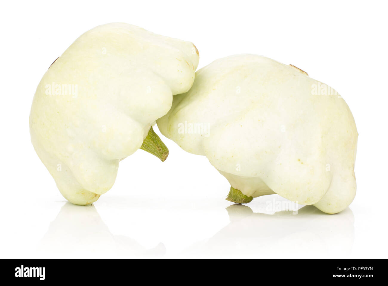 Group of two whole summer white pattypan squash isolated on white ...
