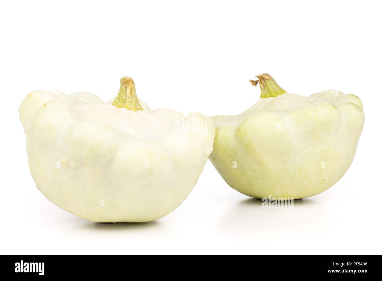 Group of two whole ripe summer white pattypan squash isolated on white ...