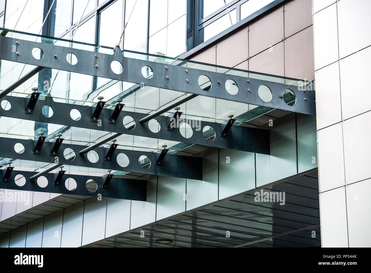 Glass roof over the entrance. Facade glazing. Reflection of the modern ...