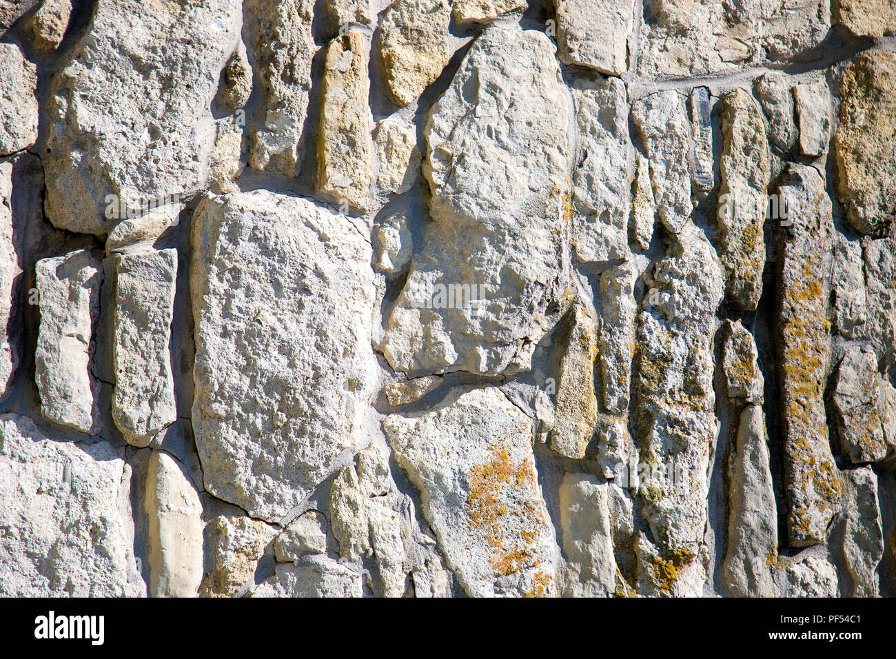 Fragment of a wall from a chipped stone. Stone texture. Stone tile ...