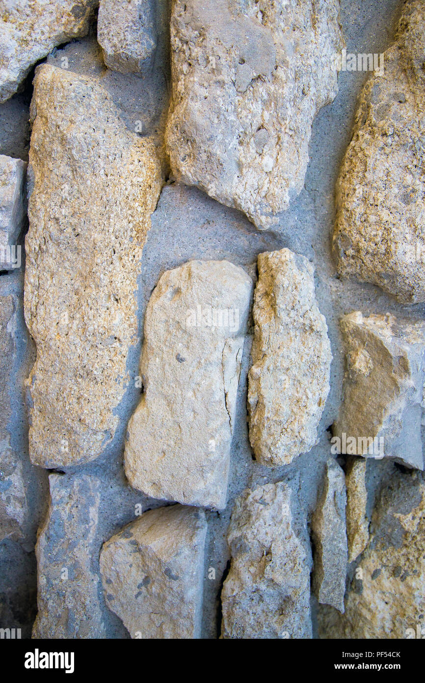 Fragment of a wall from a chipped stone. Stone texture. Stone tile ...