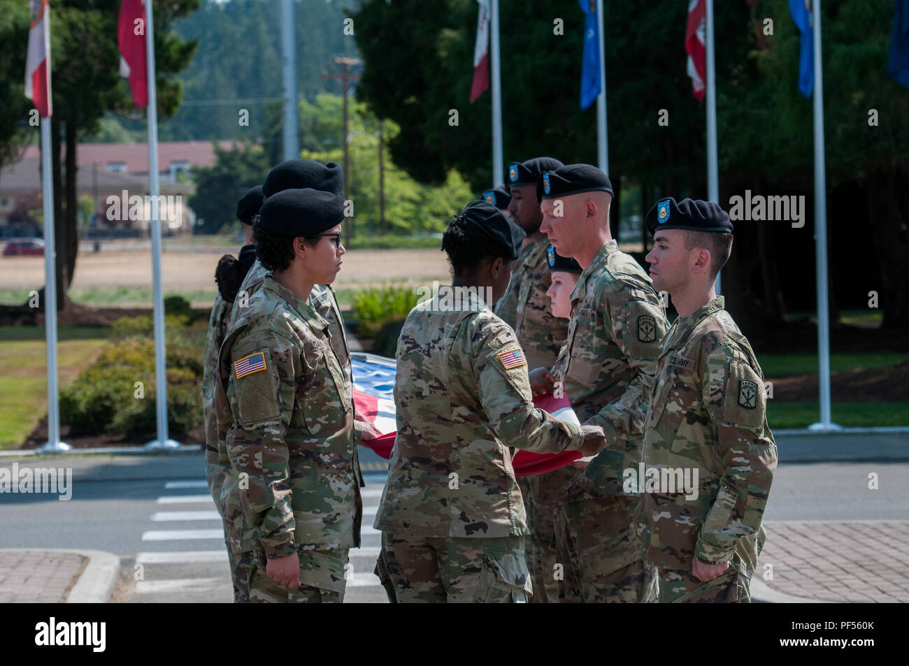 Flag bears fold the American Flag in front of the I Corps headquarters ...