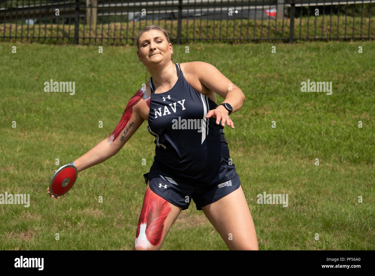 Navy Intelligence Specialist Cassidy Busch demonstrates by throwing a ...