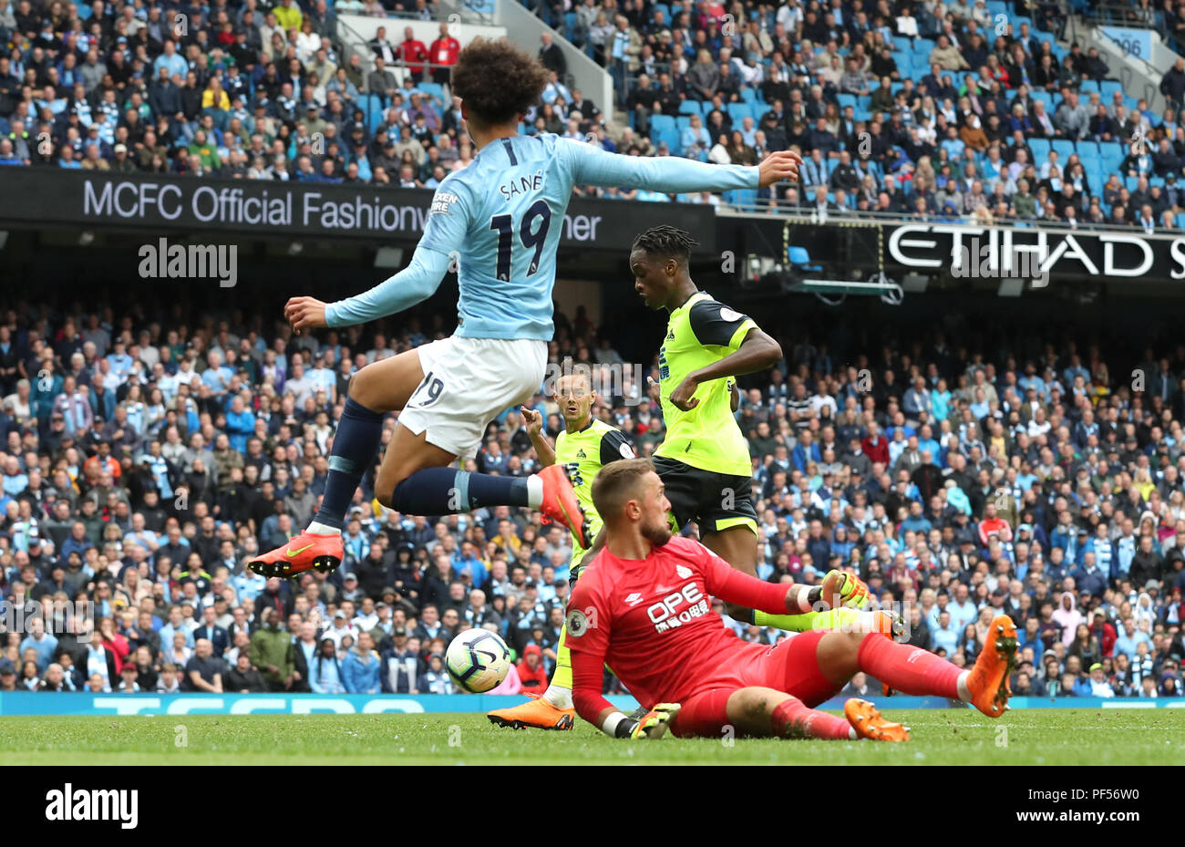 Huddersfield Town's Terence Kongolo (right) scores an own goal making ...