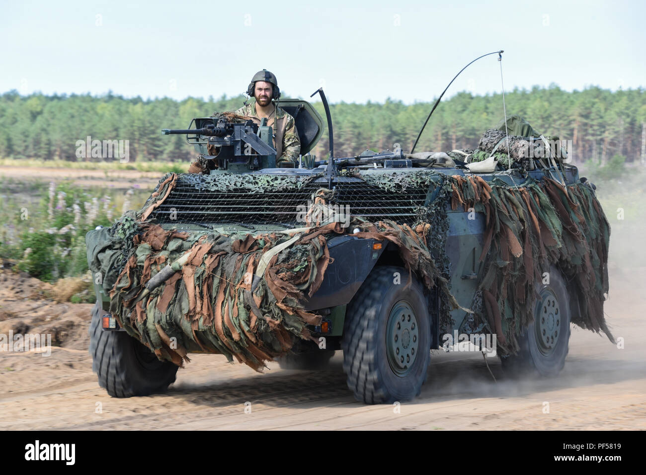 Soldiers with the Royal Netherlands Army maneuver a Fennek light ...
