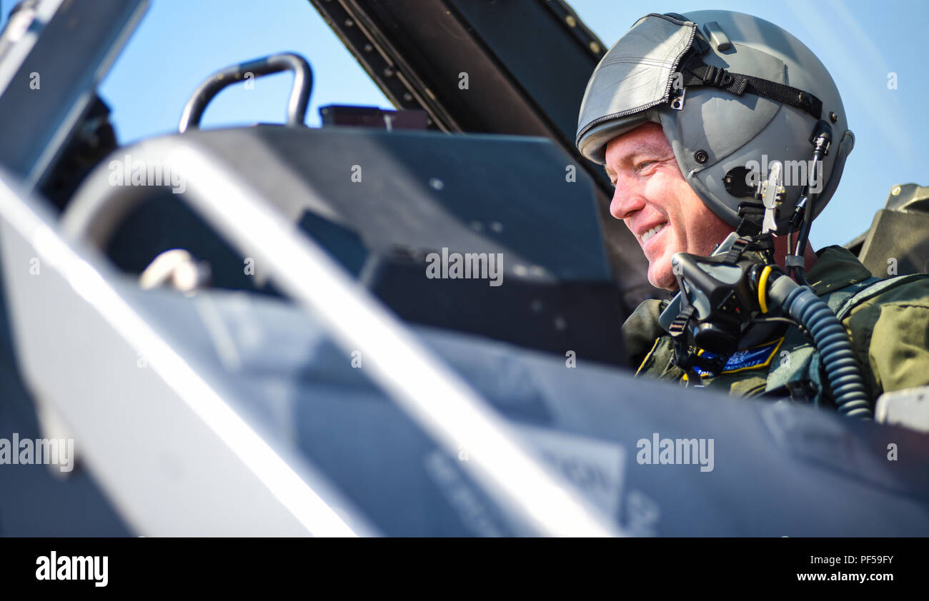 Col. Troy Endicott, 460th Space Wing commander, smiles to his wife ...