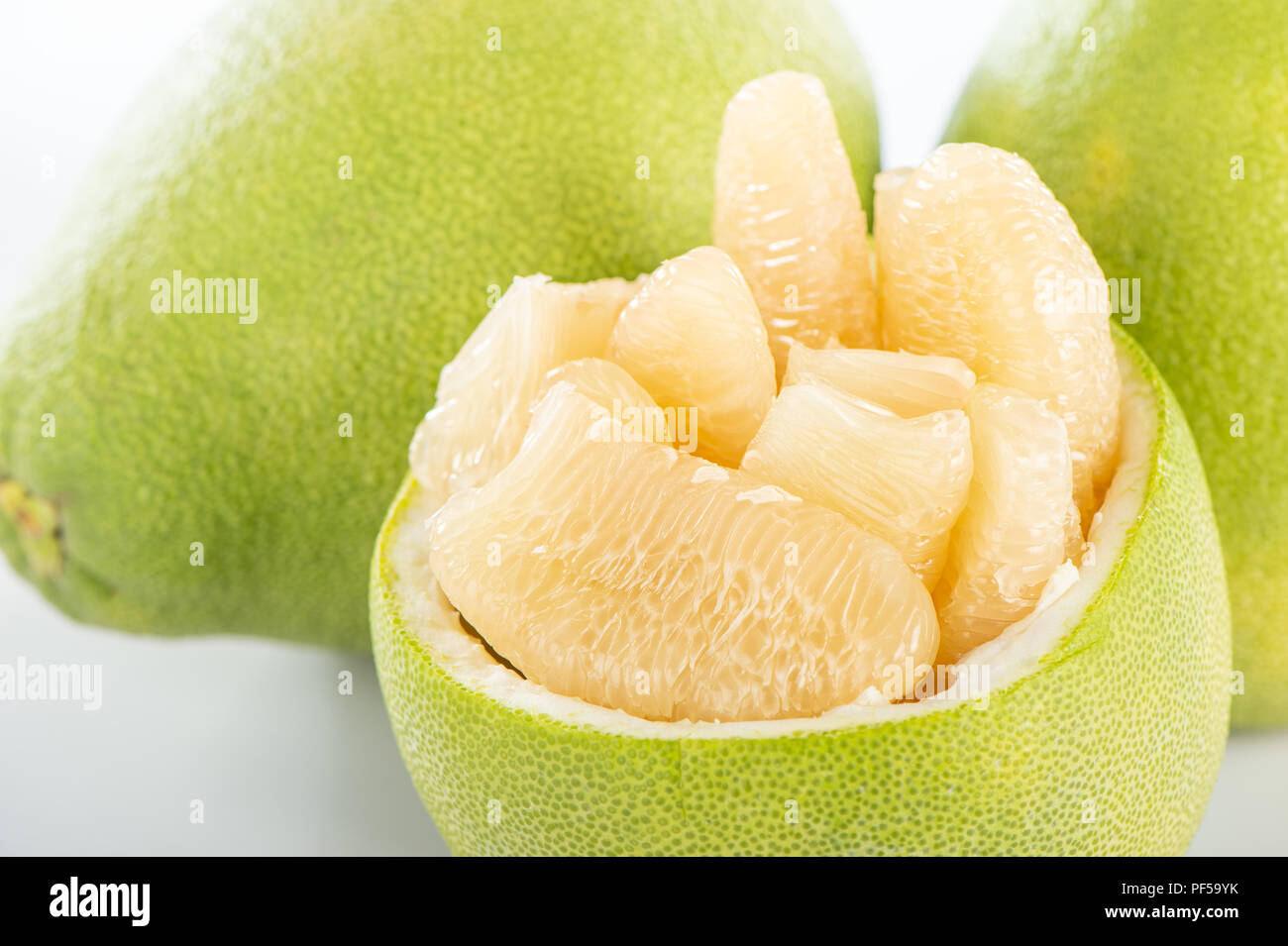 fresh and peeled pomelo(shaddock), grapefruit with slices isolated on ...