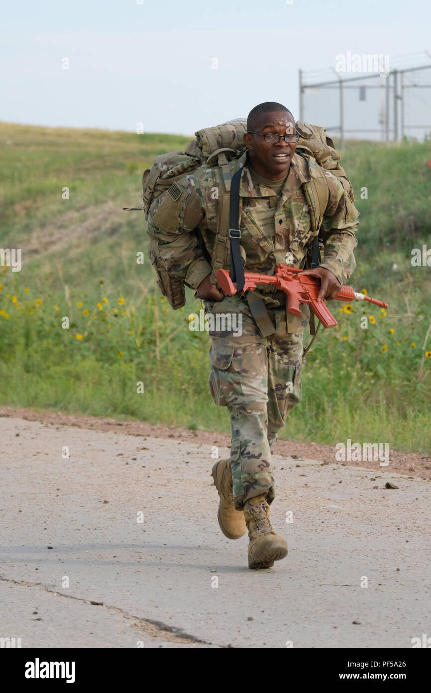 A Soldier nears the finish line at the squad ruck relay event during ...