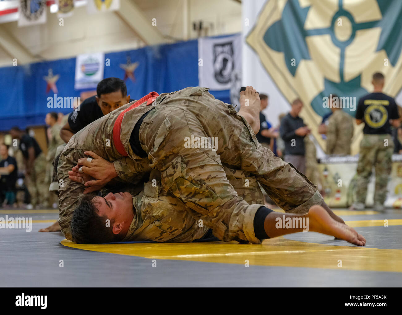 Two Soldiers compete in day 1 of the combatives tournament during Ivy ...