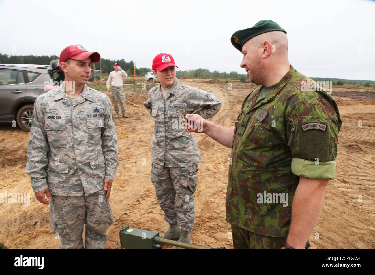 Members of the 201st RED HORSE squadron exchange patches with service ...
