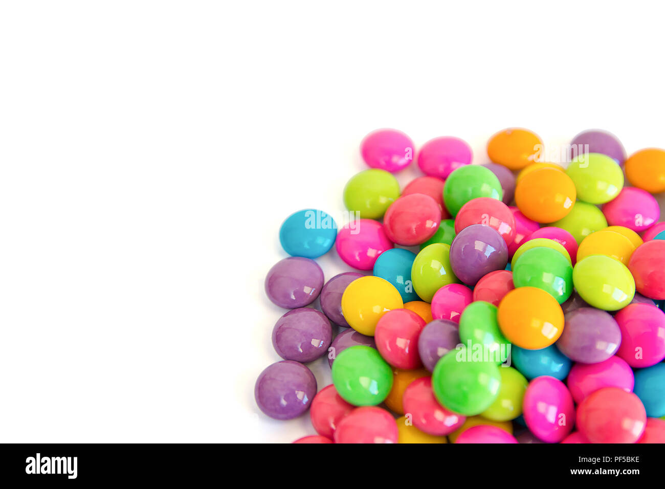 colorful chocolate coated candy isolated on white background. with copy ...